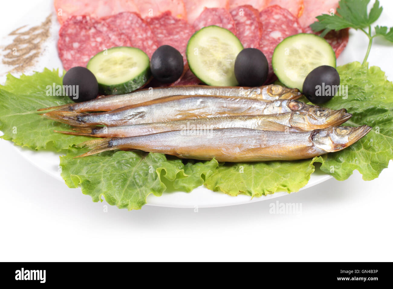 kipper fish on composition with vegetables Stock Photo - Alamy