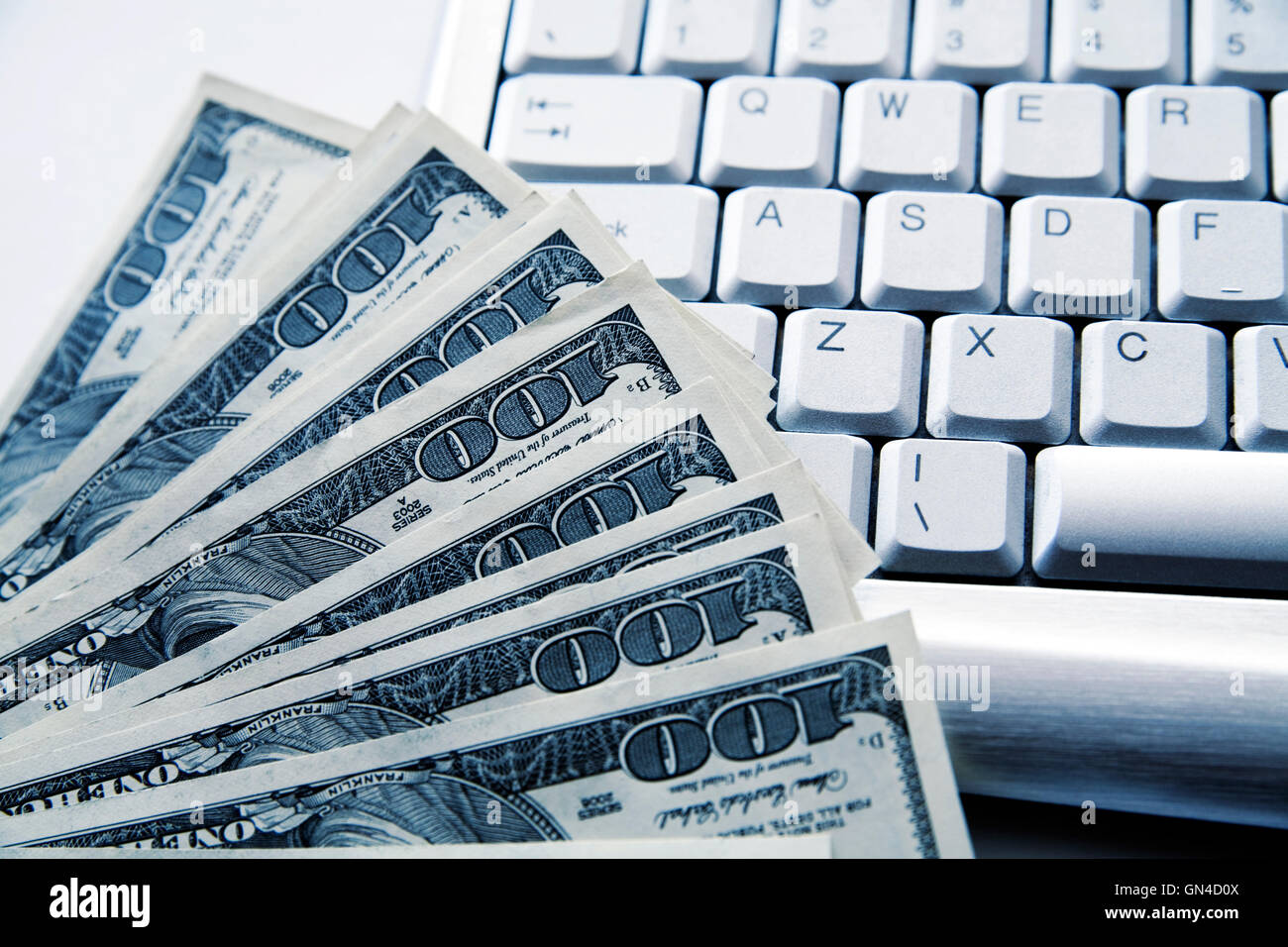 dollar banknotes on a background an aluminium computer keyboard Stock ...