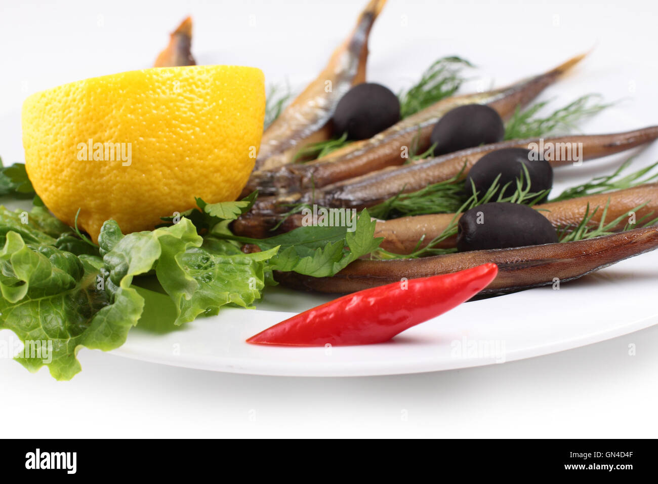 kipper fish on composition with vegetables Stock Photo - Alamy