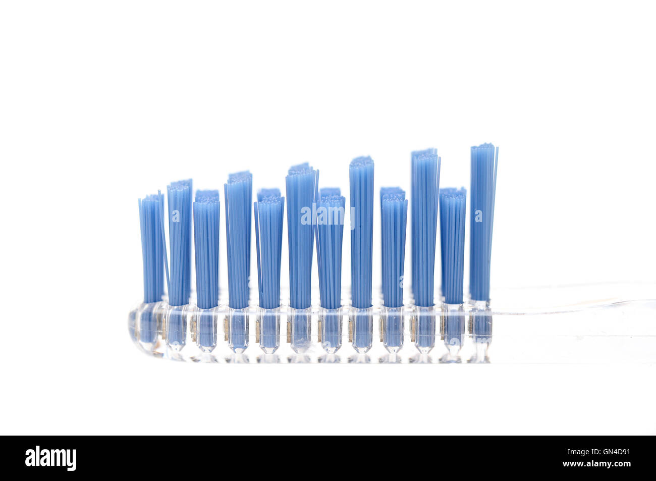 Close up toothbrushes over white background Stock Photo - Alamy