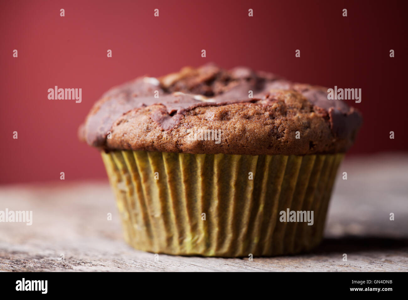 single muffin on red background Stock Photo - Alamy