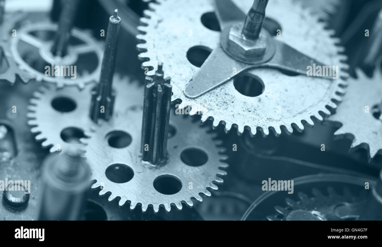 Gearwheels inside clock mechanism. Concept Teamwork , Idea Technology ...