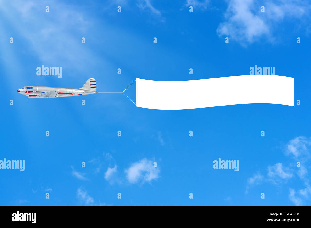 Flying airplane and banner on sky background Stock Photo - Alamy