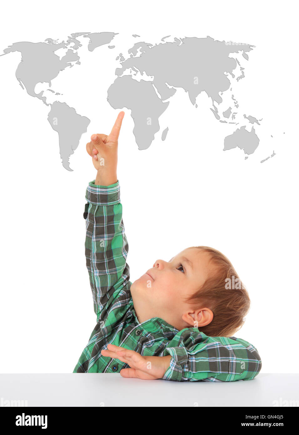 Boy pointing at world map Stock Photo - Alamy