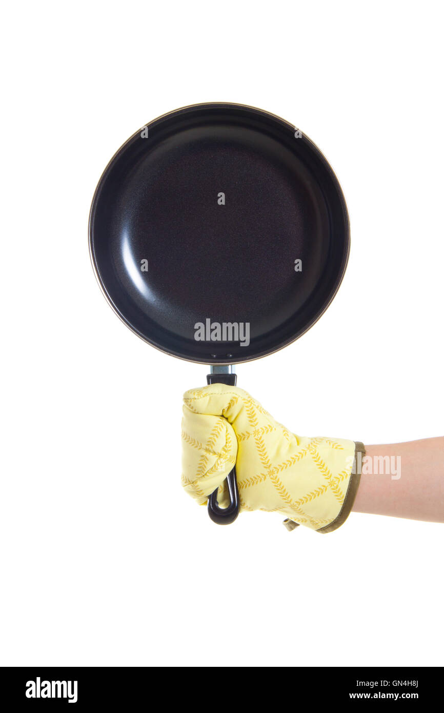 hand in gloves holding pan Stock Photo - Alamy