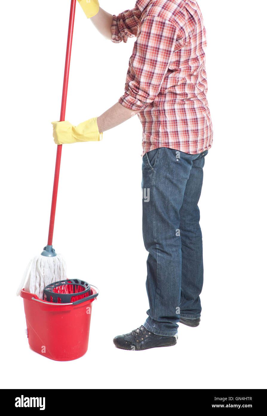 man puts the mop in a bucket Stock Photo - Alamy