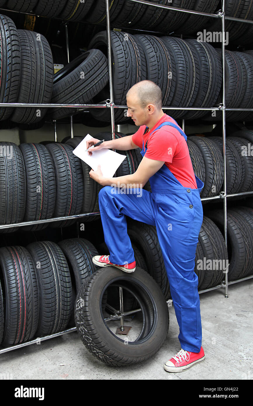 Worker checking tires hi-res stock photography and images - Alamy