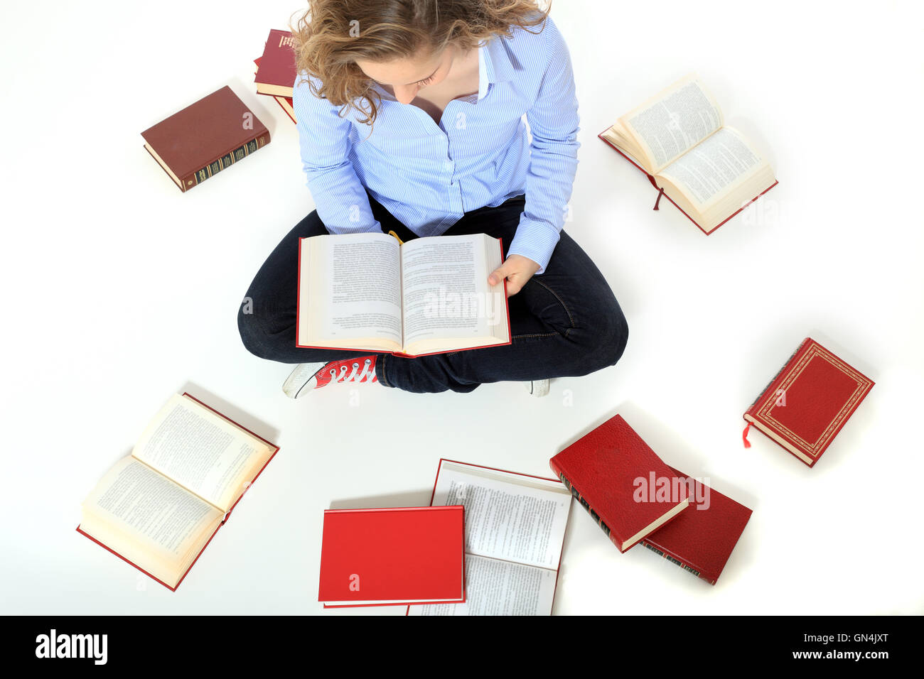 Teen girl sitting curled up hi-res stock photography and images - Alamy