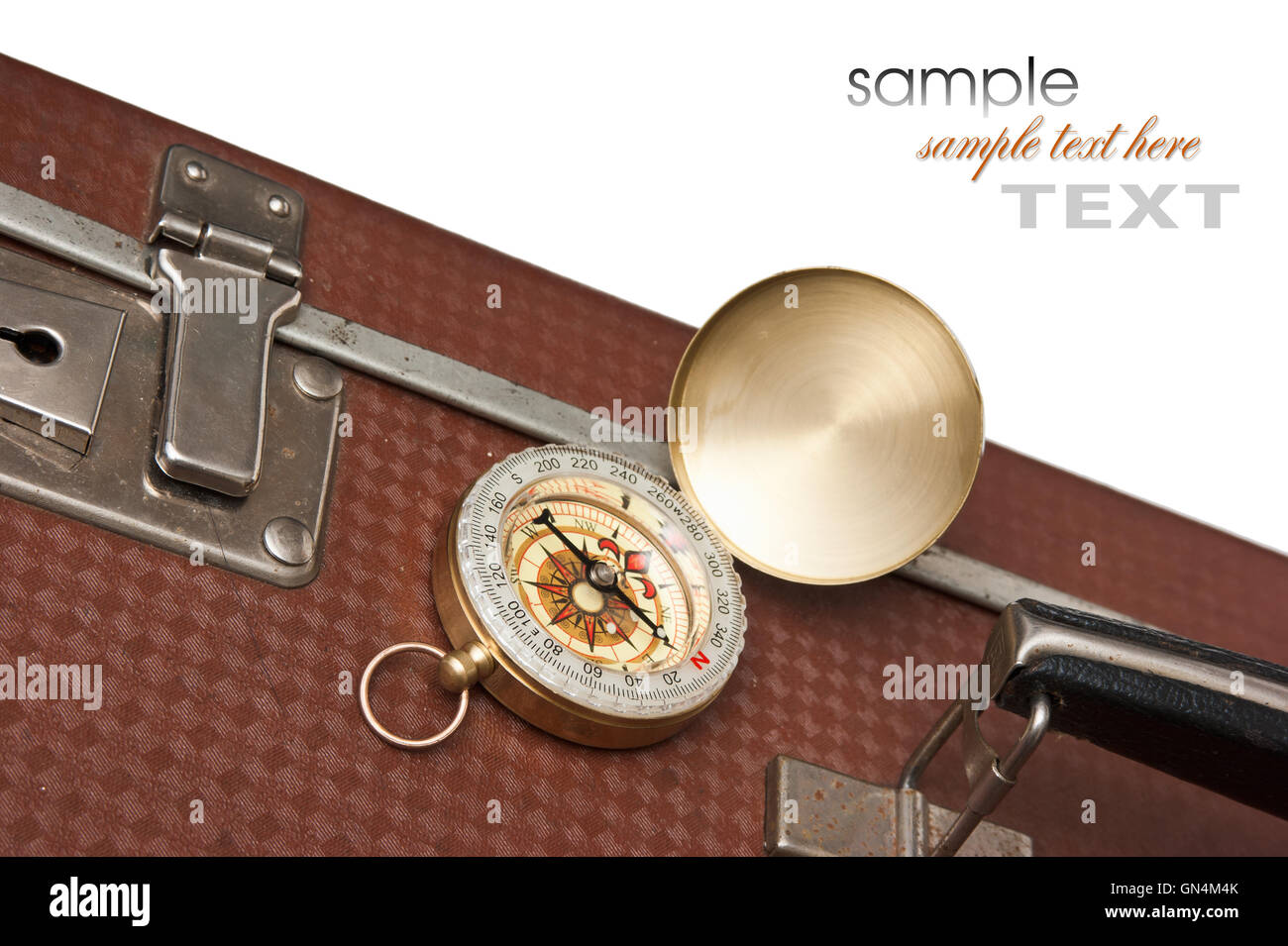 old suitcase with a compass Stock Photo - Alamy