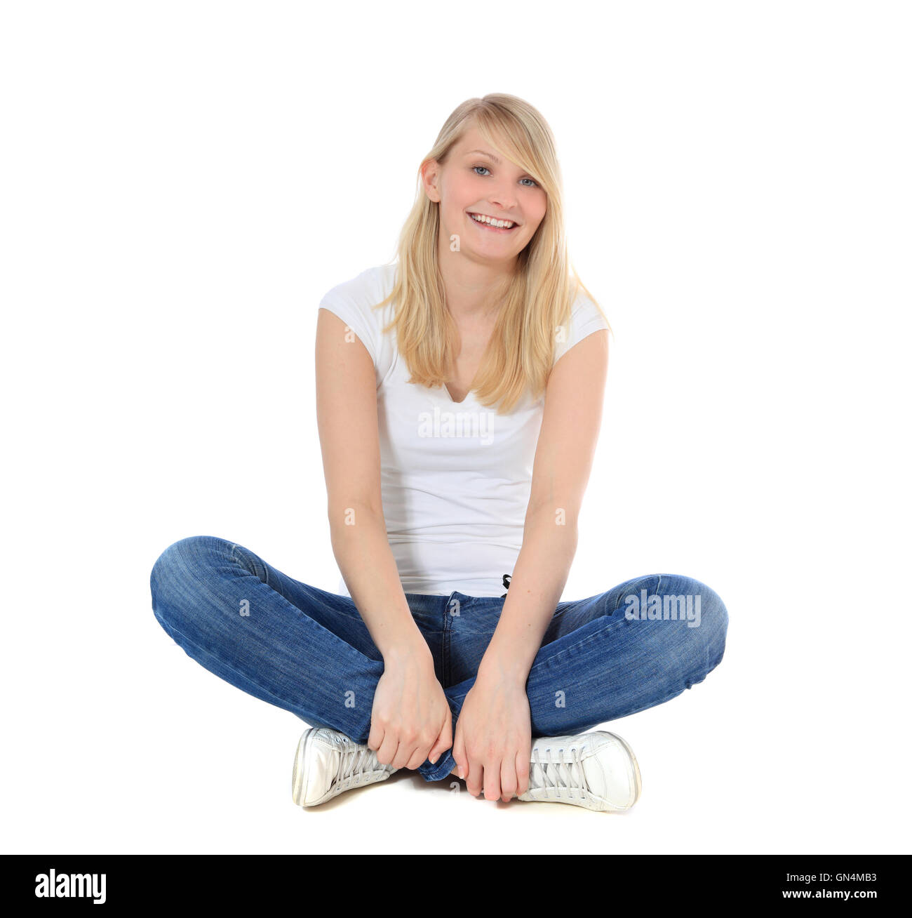 Young woman sitting Stock Photo - Alamy