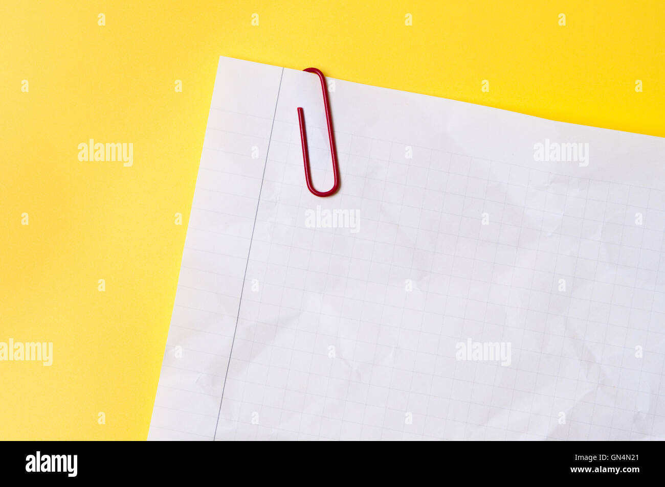Crumpled sheet and paper clip Stock Photo - Alamy