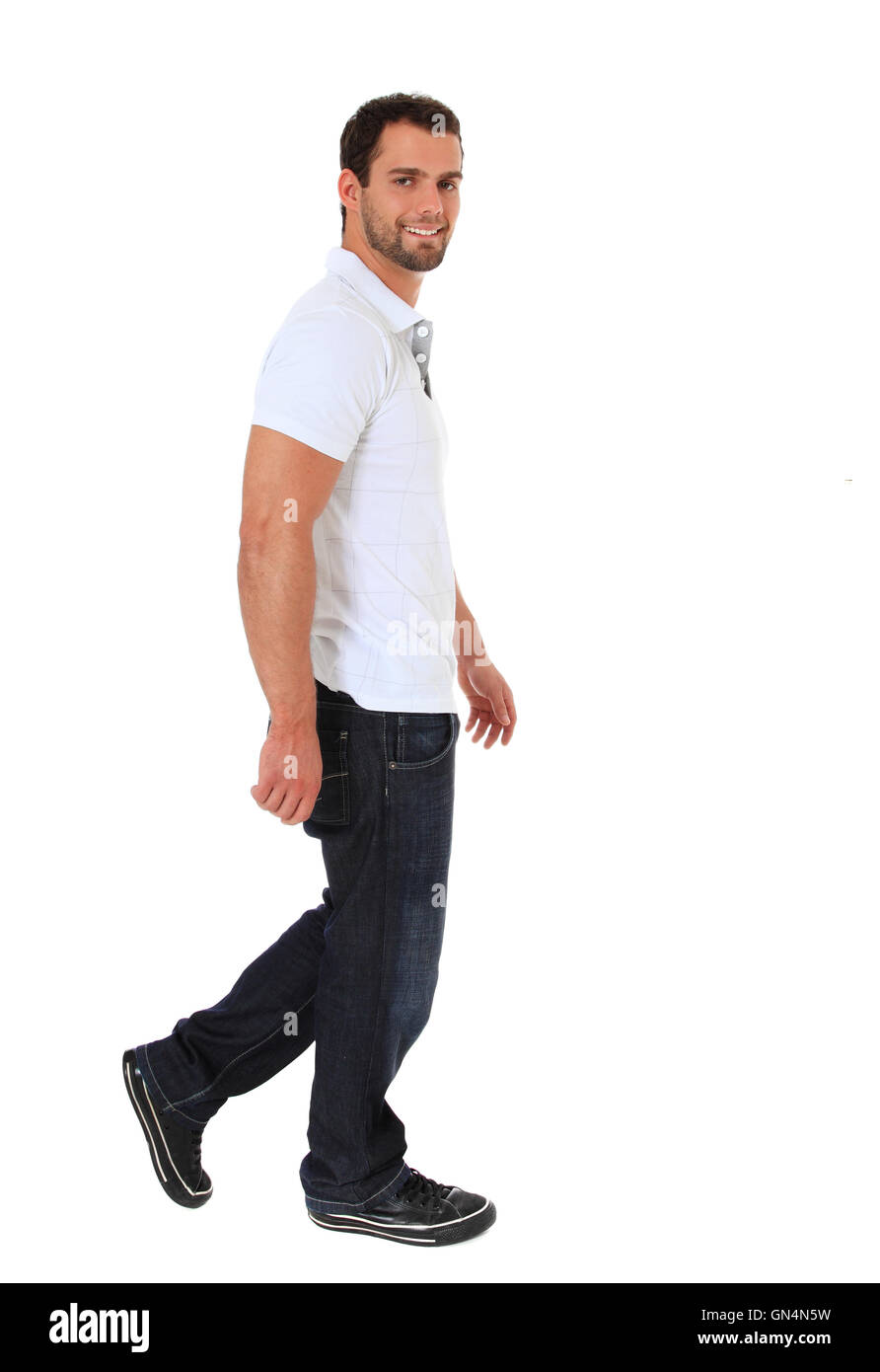 Young man walking Stock Photo - Alamy
