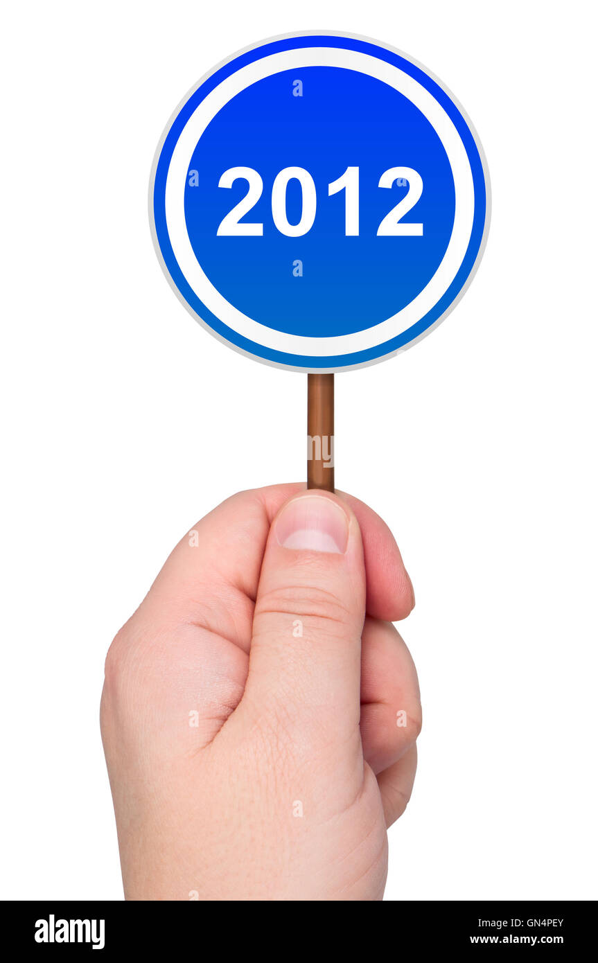 2012 road sign in hand isolated on white background Stock Photo - Alamy