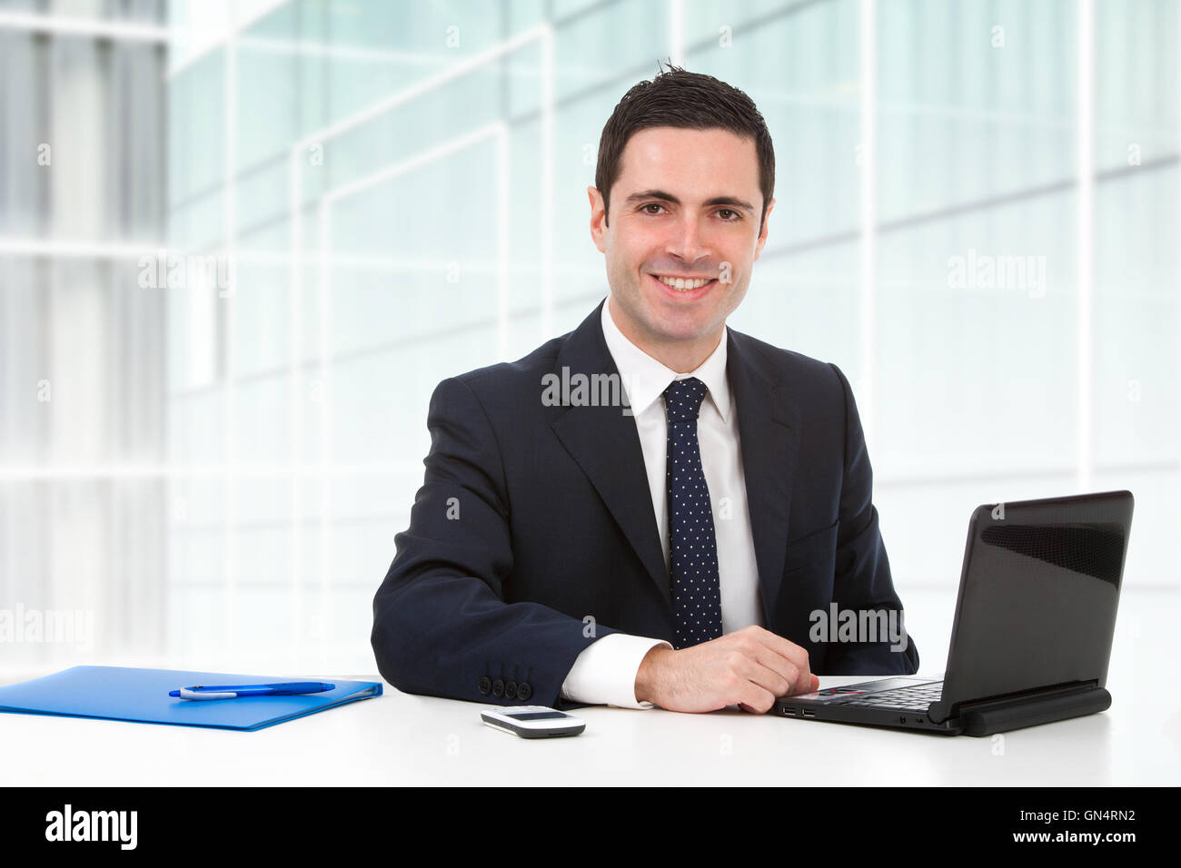 Portrait of office worker at desk Stock Photo - Alamy