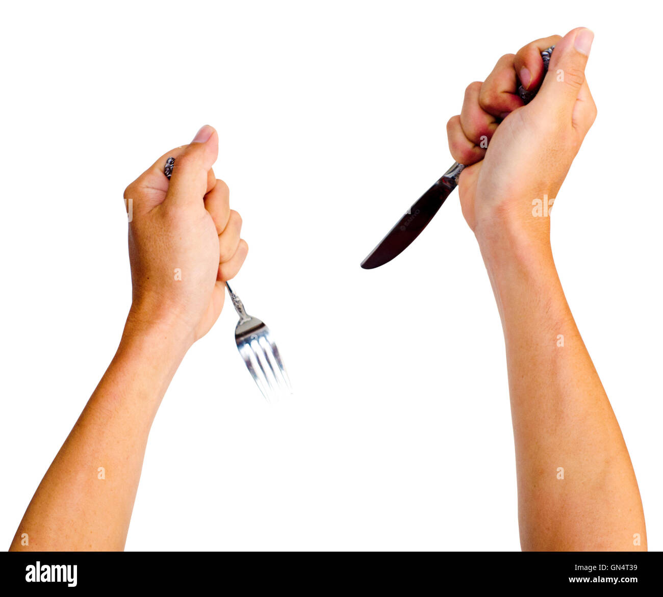 hands gripping knife and fork Stock Photo - Alamy
