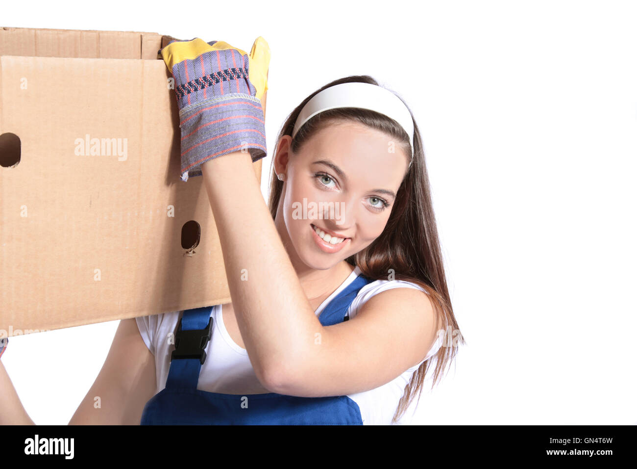 Young woman carrying moving box Stock Photo - Alamy