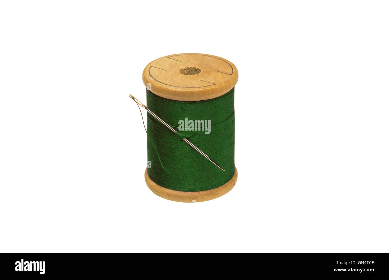 Spool of thread and needle isolated Stock Photo - Alamy