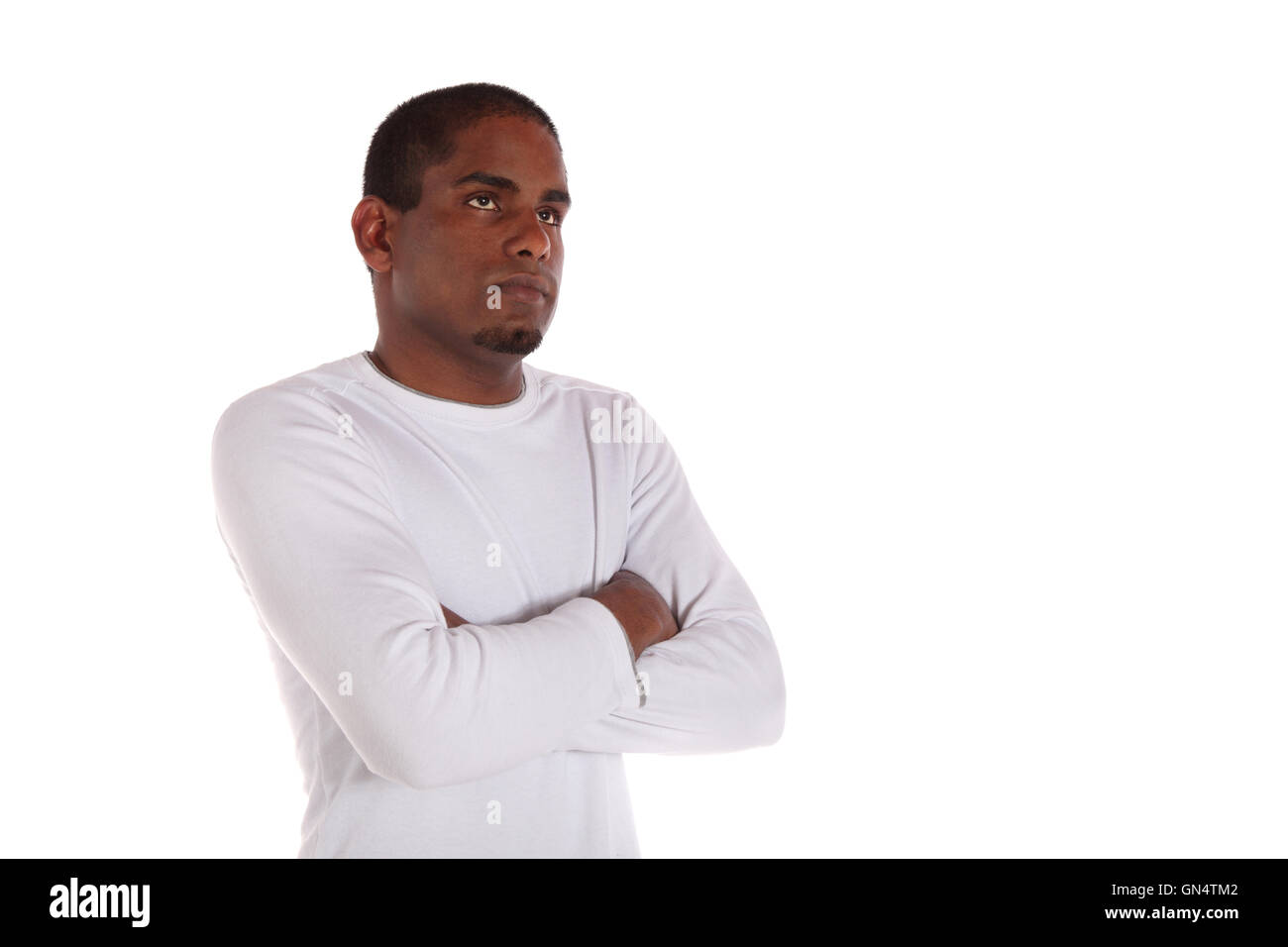 Young man looking seriously Stock Photo - Alamy