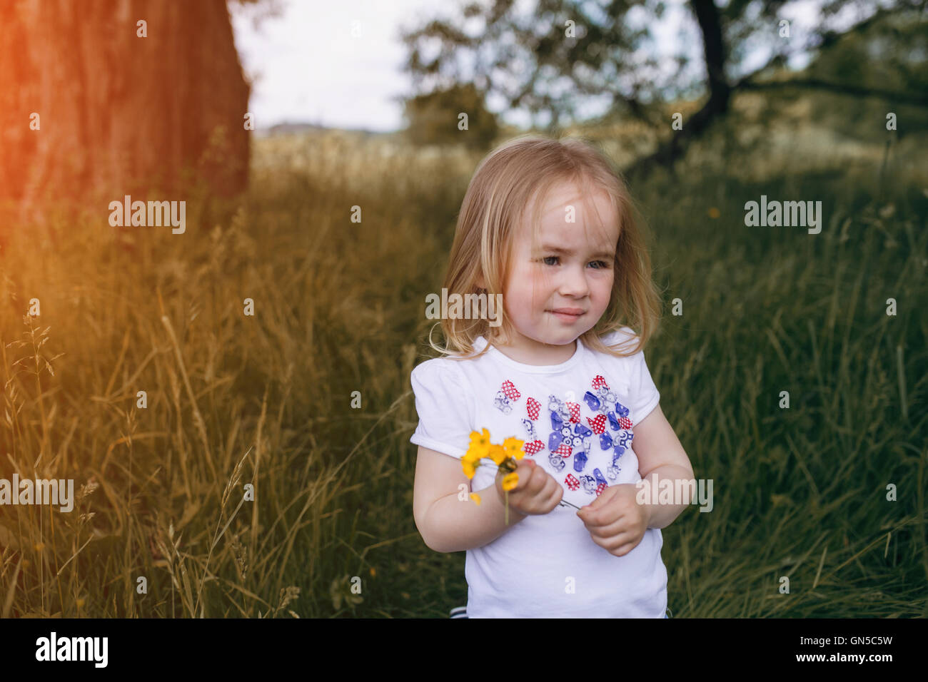 child near tree Stock Photo - Alamy