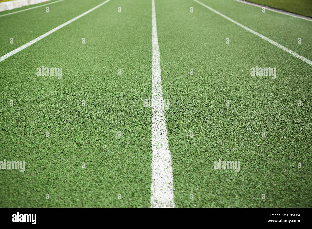 Green lanes on a running track Stock Photo - Alamy