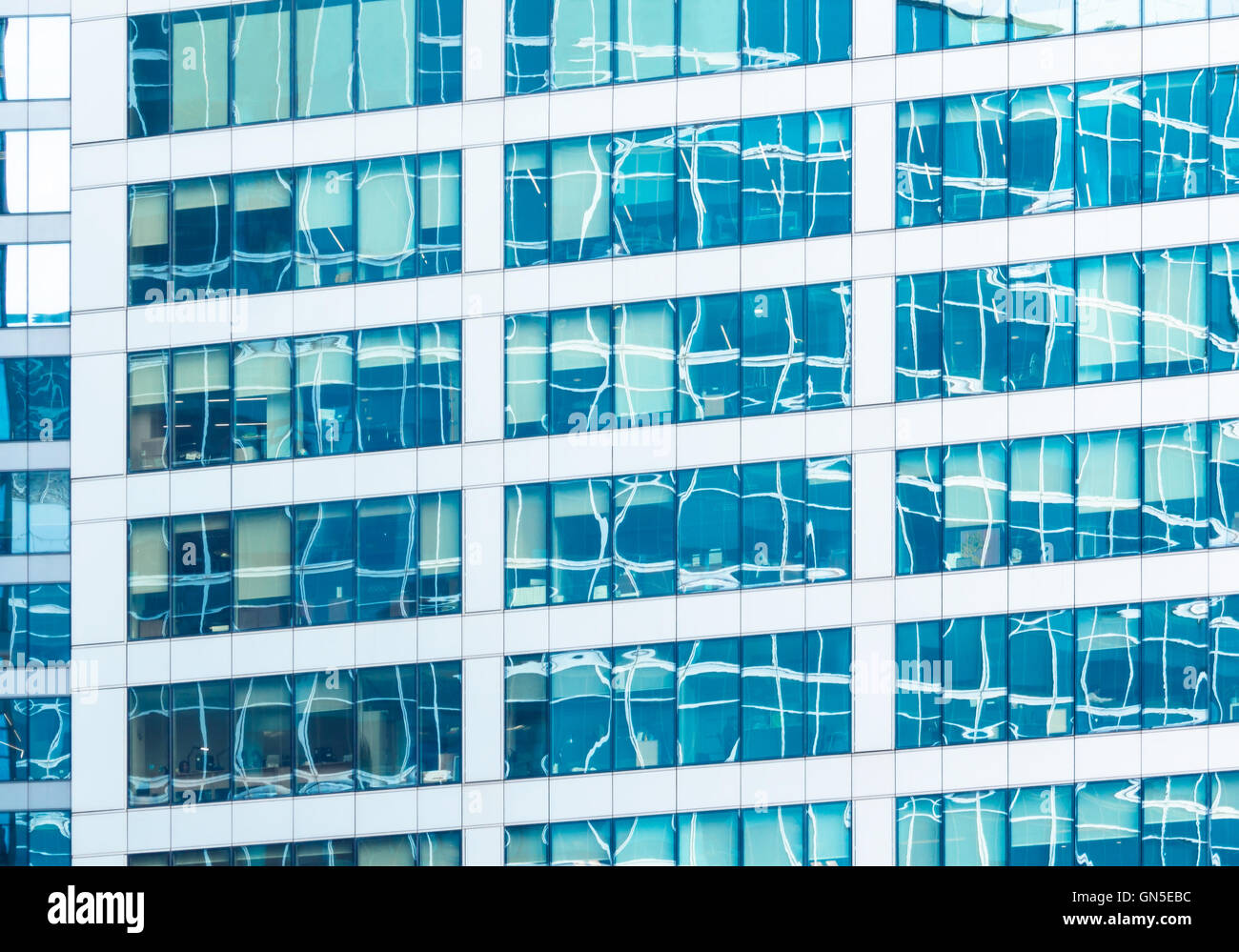 Close-up of the glass office building with reflections Stock Photo - Alamy