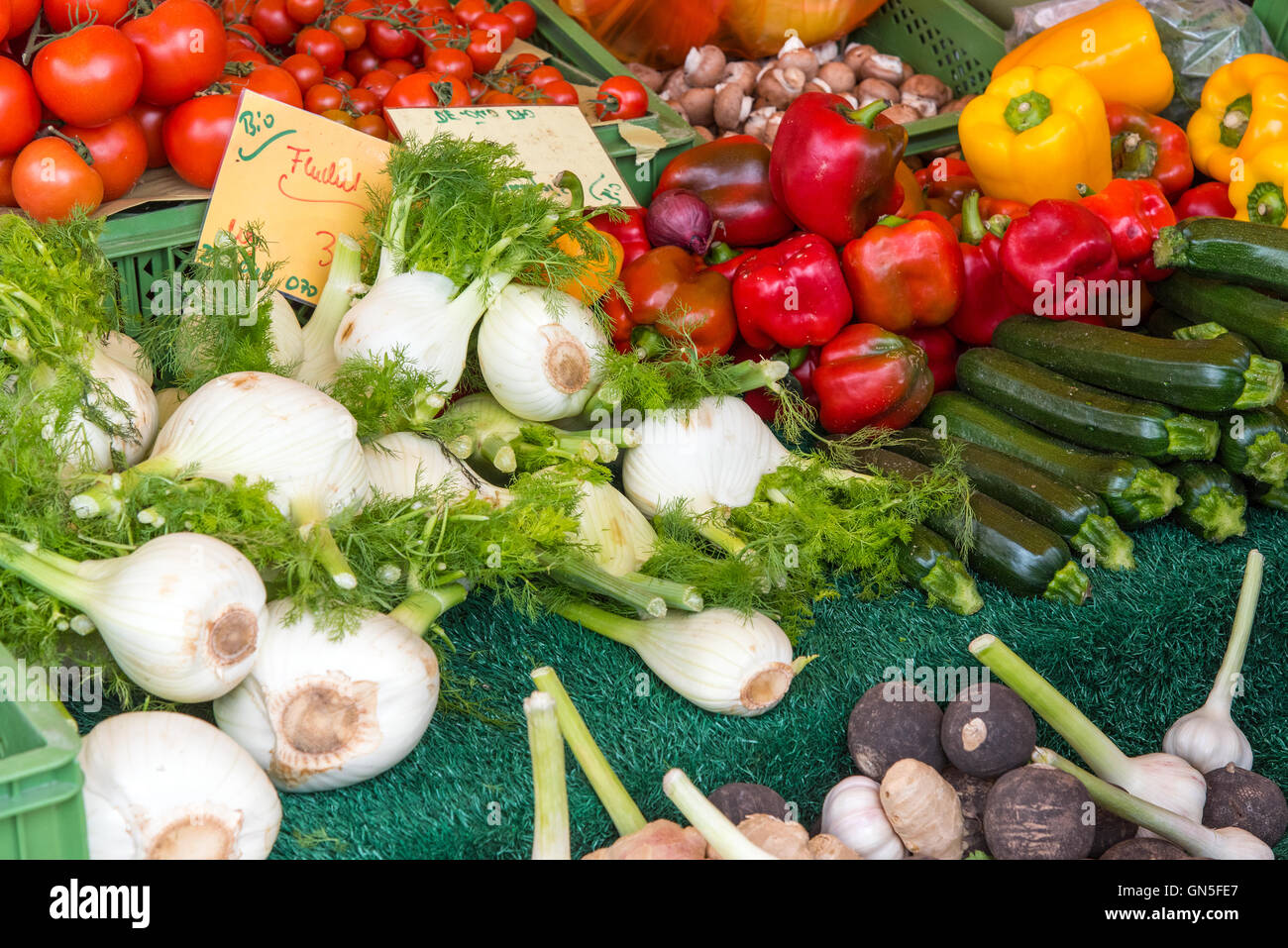 Fennel, pepper, courgette and other vegetables for sale at a market ...