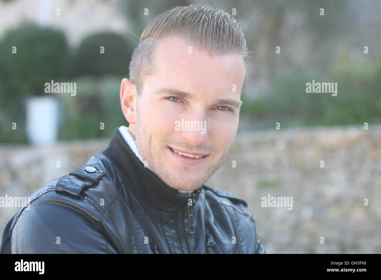 Handsome blond man smiling Stock Photo - Alamy
