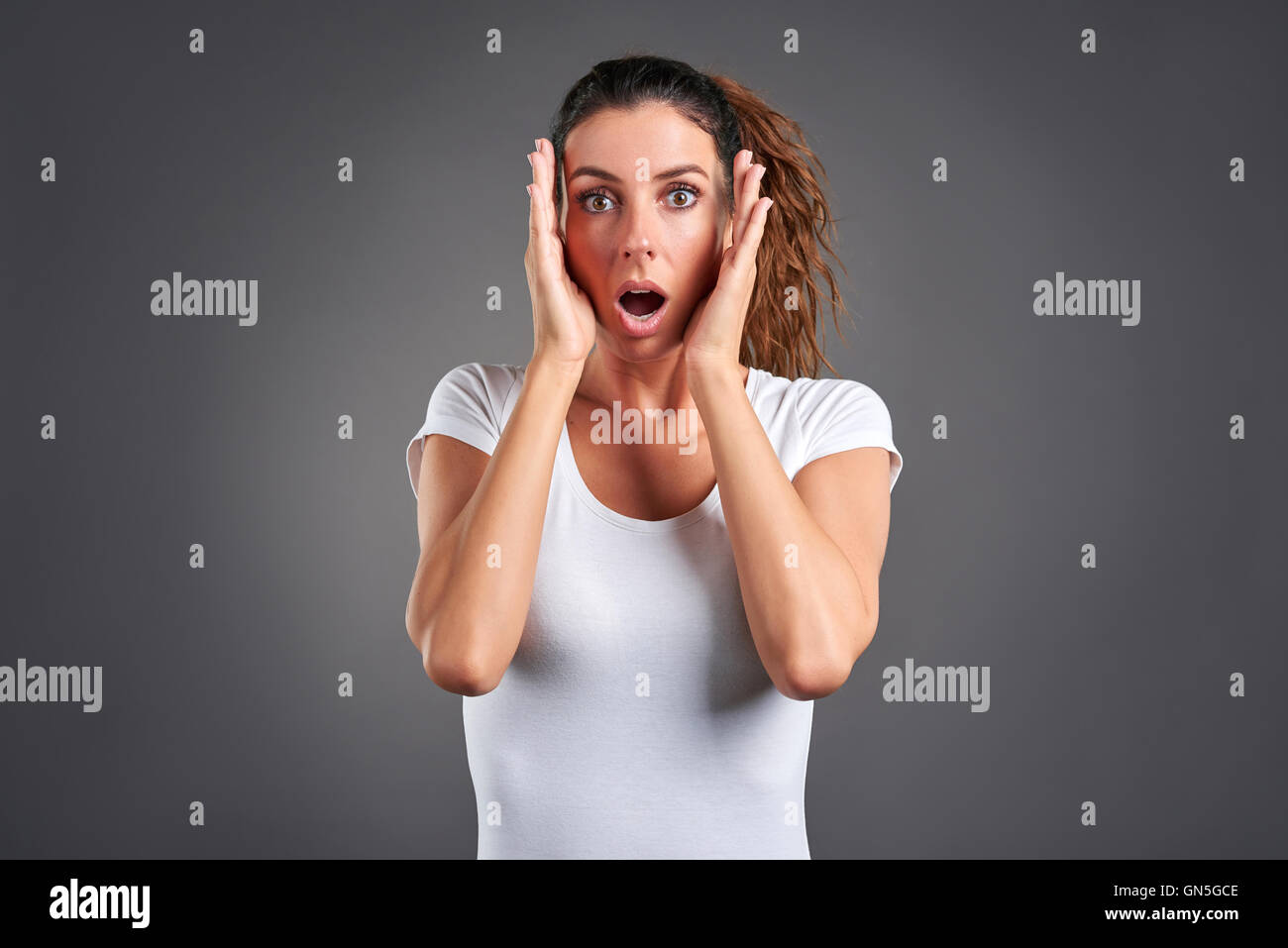 A beautiful young woman feeling scared Stock Photo - Alamy