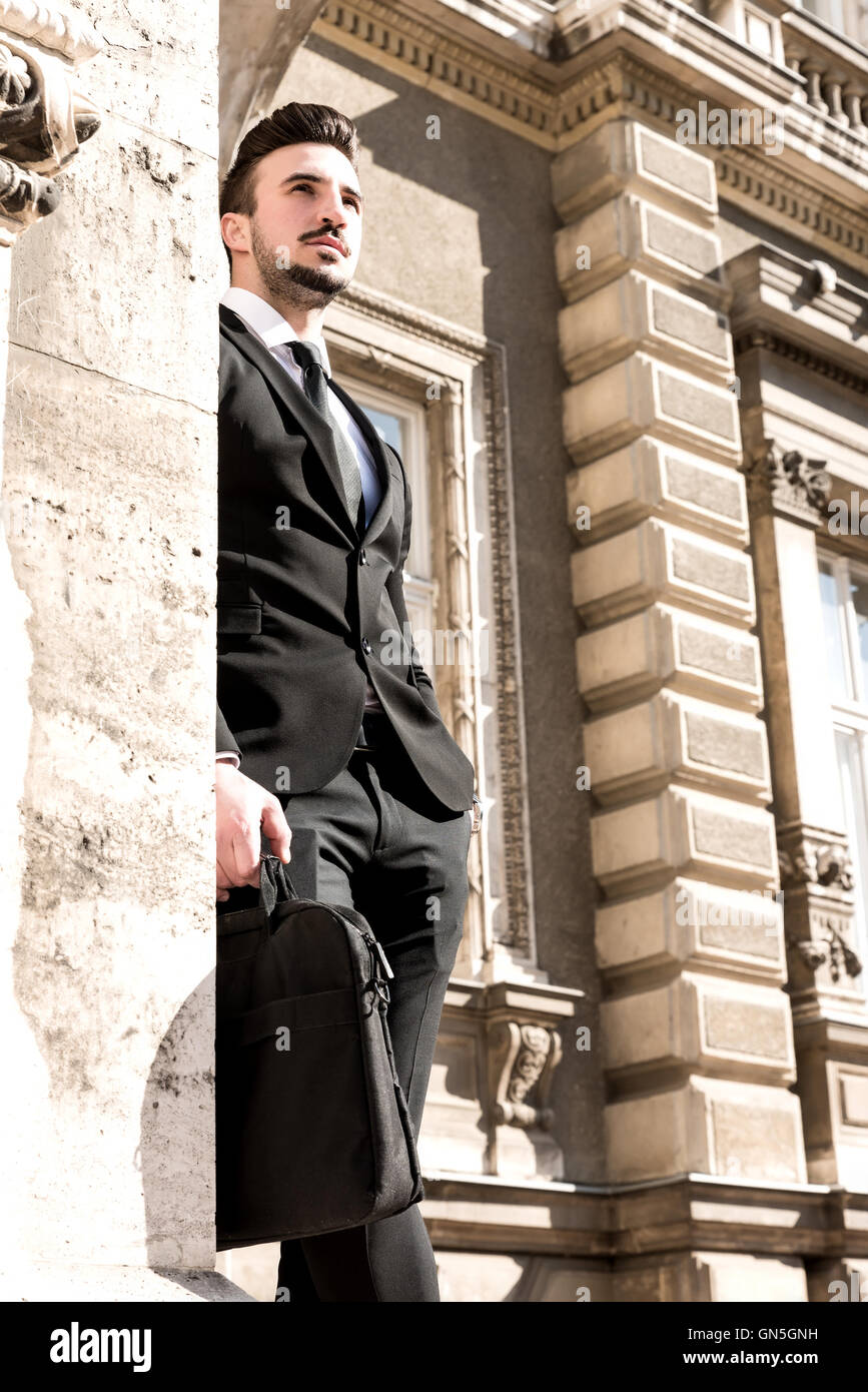 Young businessman waiting outside on the street Stock Photo - Alamy