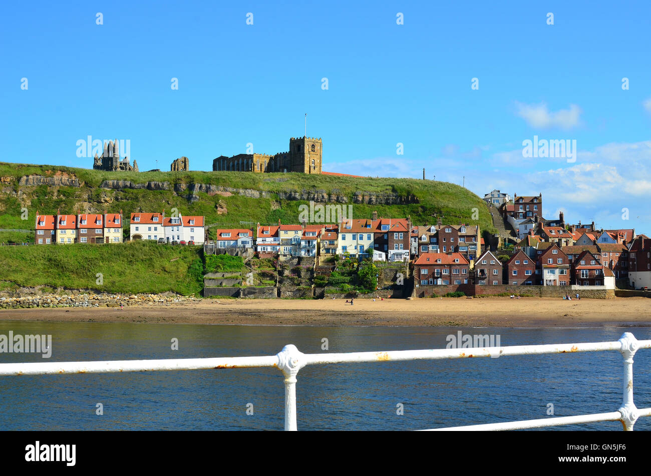 A view of Whitby Abbey and church across the Harbour of Whitby in the ...