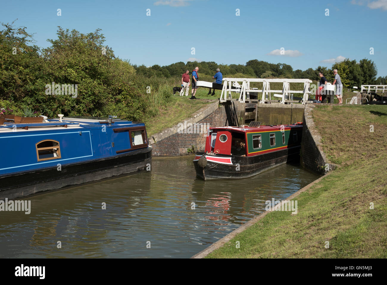 Canal boat on the Kennet and Avon Canal passing through one of the Caen ...