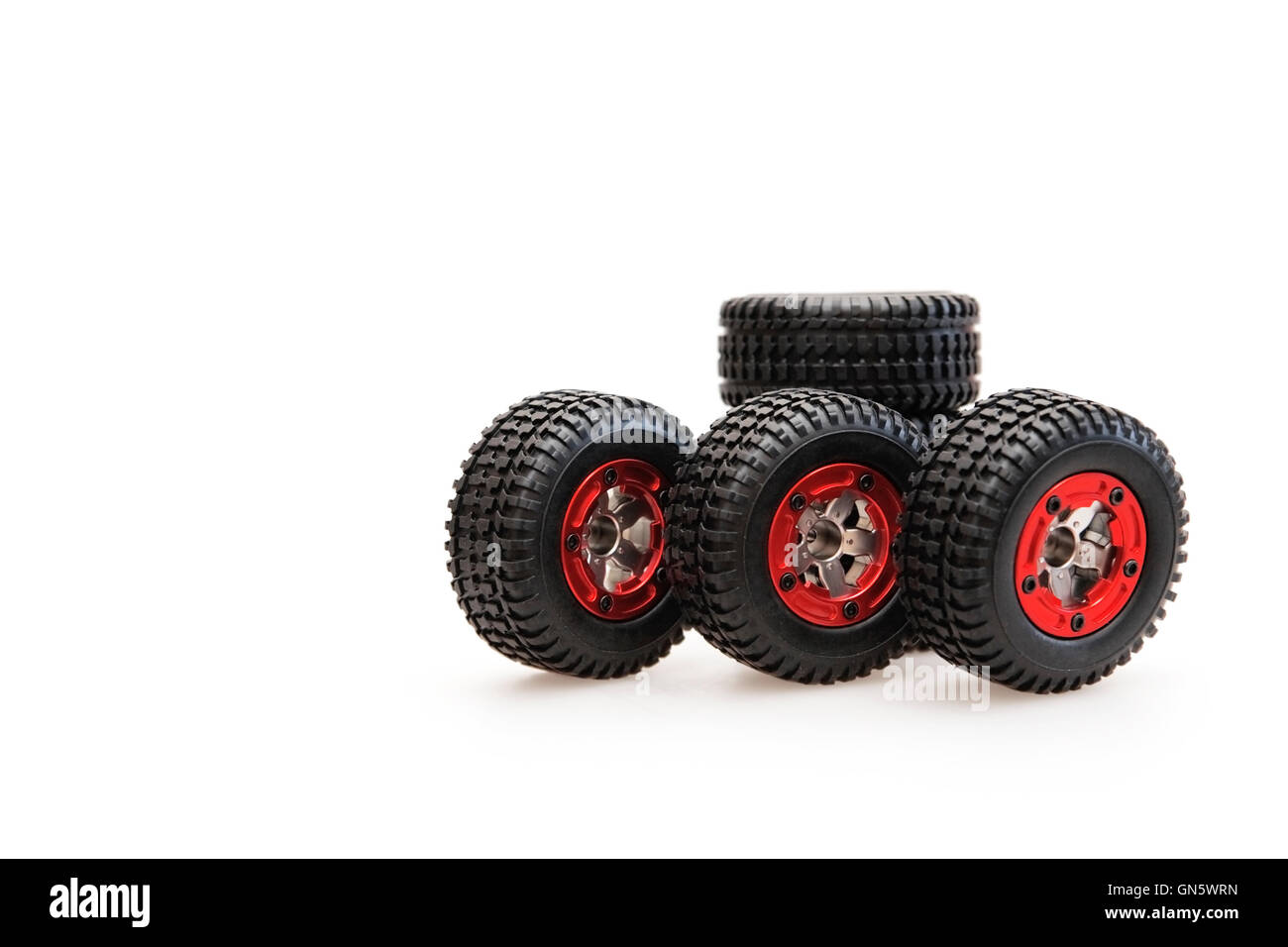 Rubber tires on red rims Stock Photo - Alamy