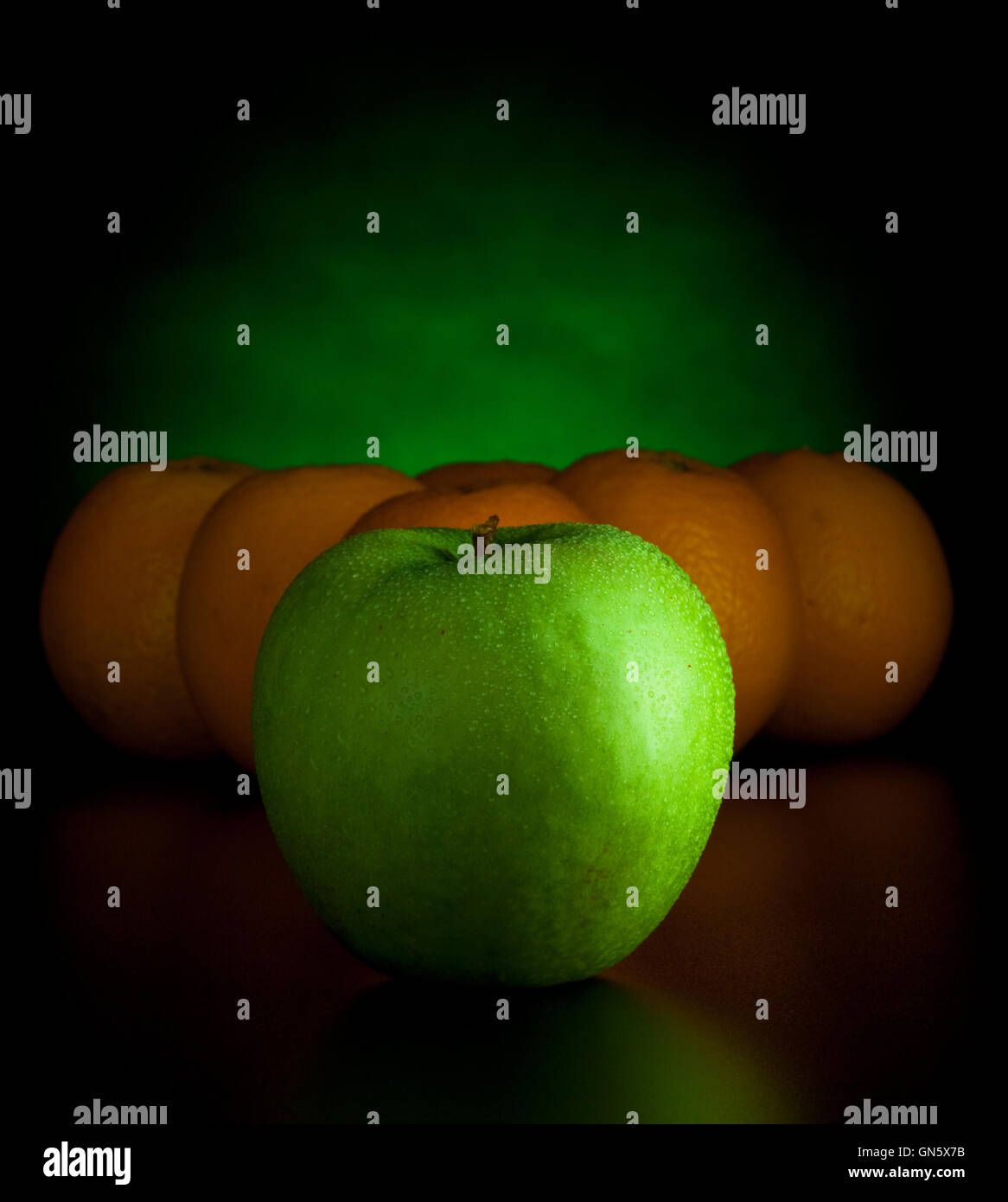 oranges and apple like billiard balls Stock Photo - Alamy