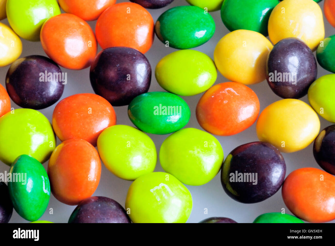 Orange and green multicolored sweets hi-res stock photography and ...