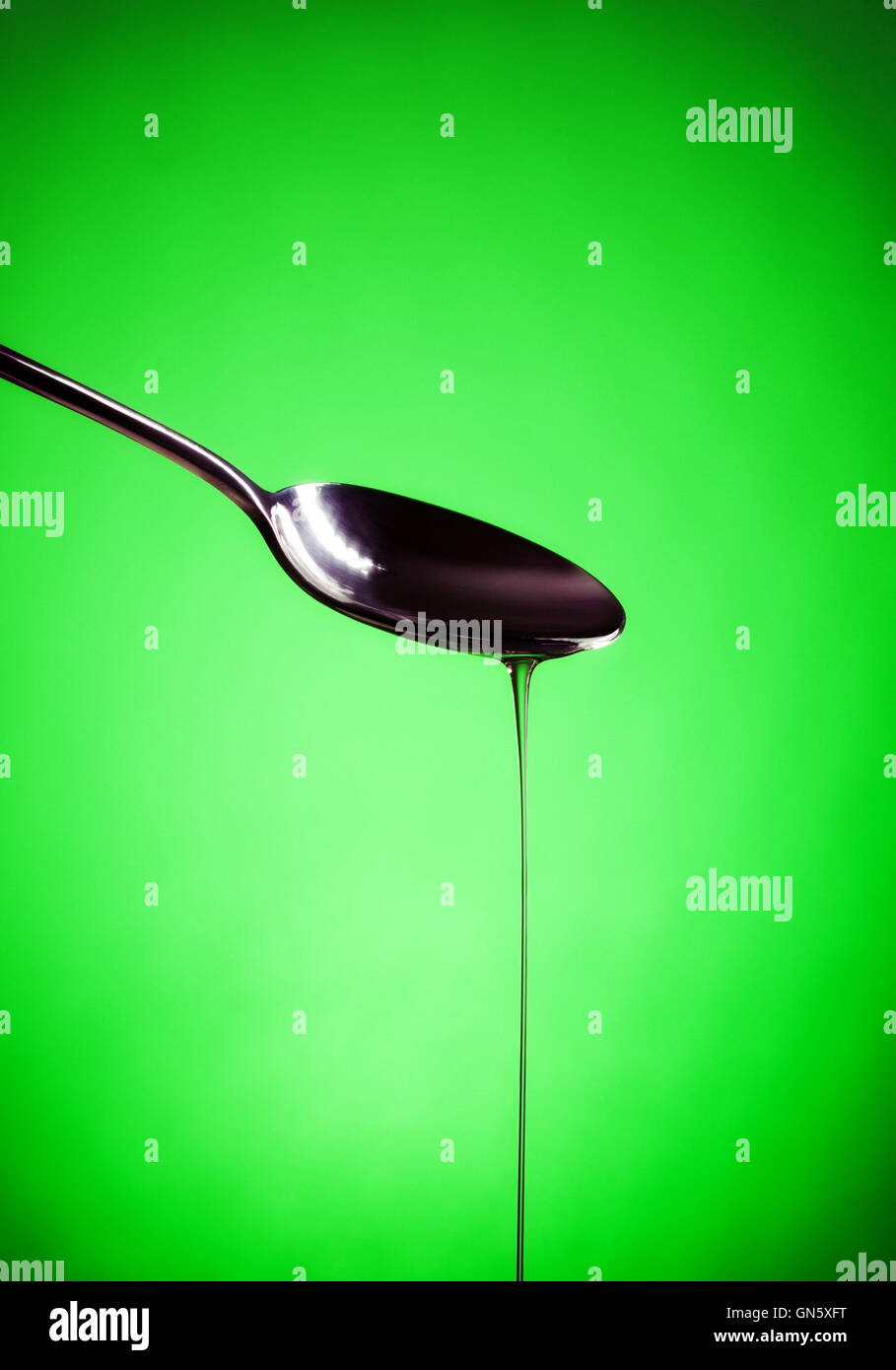 oil spill out of spoon Stock Photo - Alamy