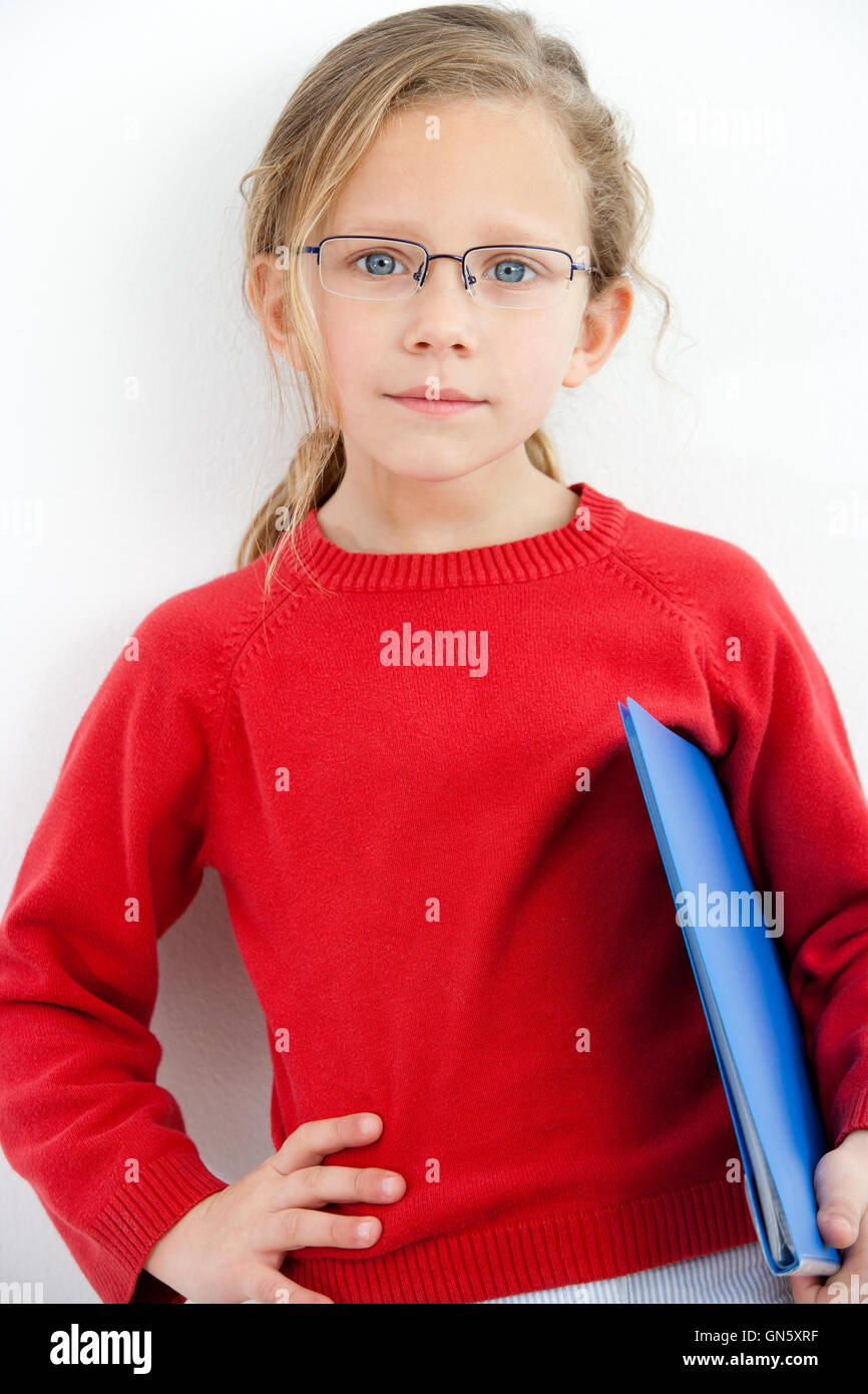 Cute girl holding notebook Stock Photo - Alamy