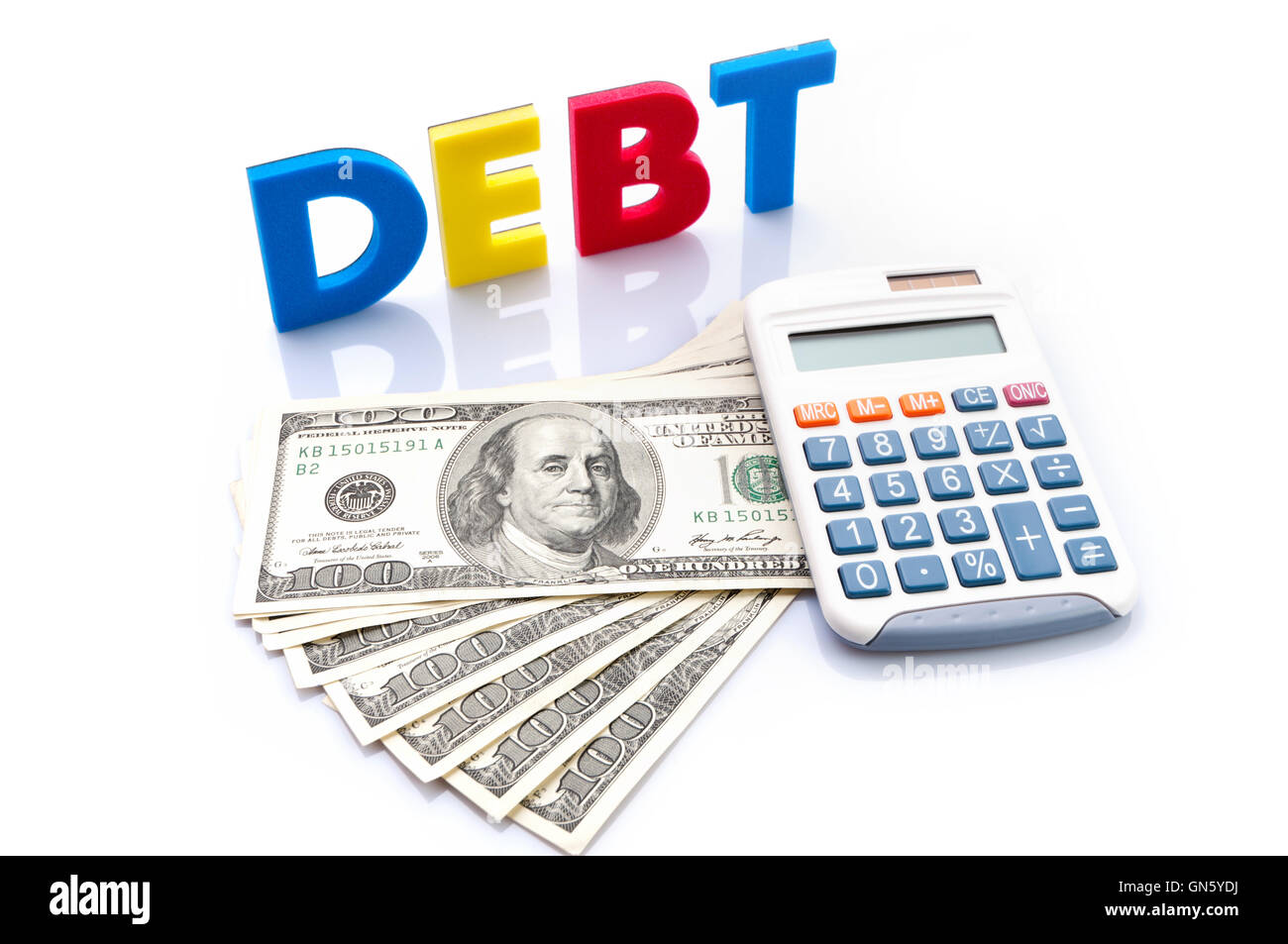 Debt words, American banknotes and calculator Stock Photo - Alamy