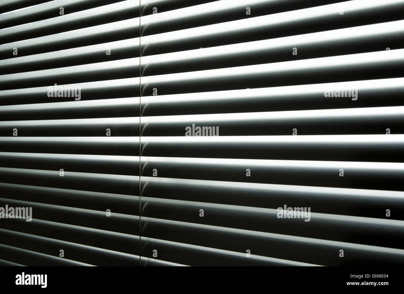 Light coming through closed metallic blinds Stock Photo - Alamy