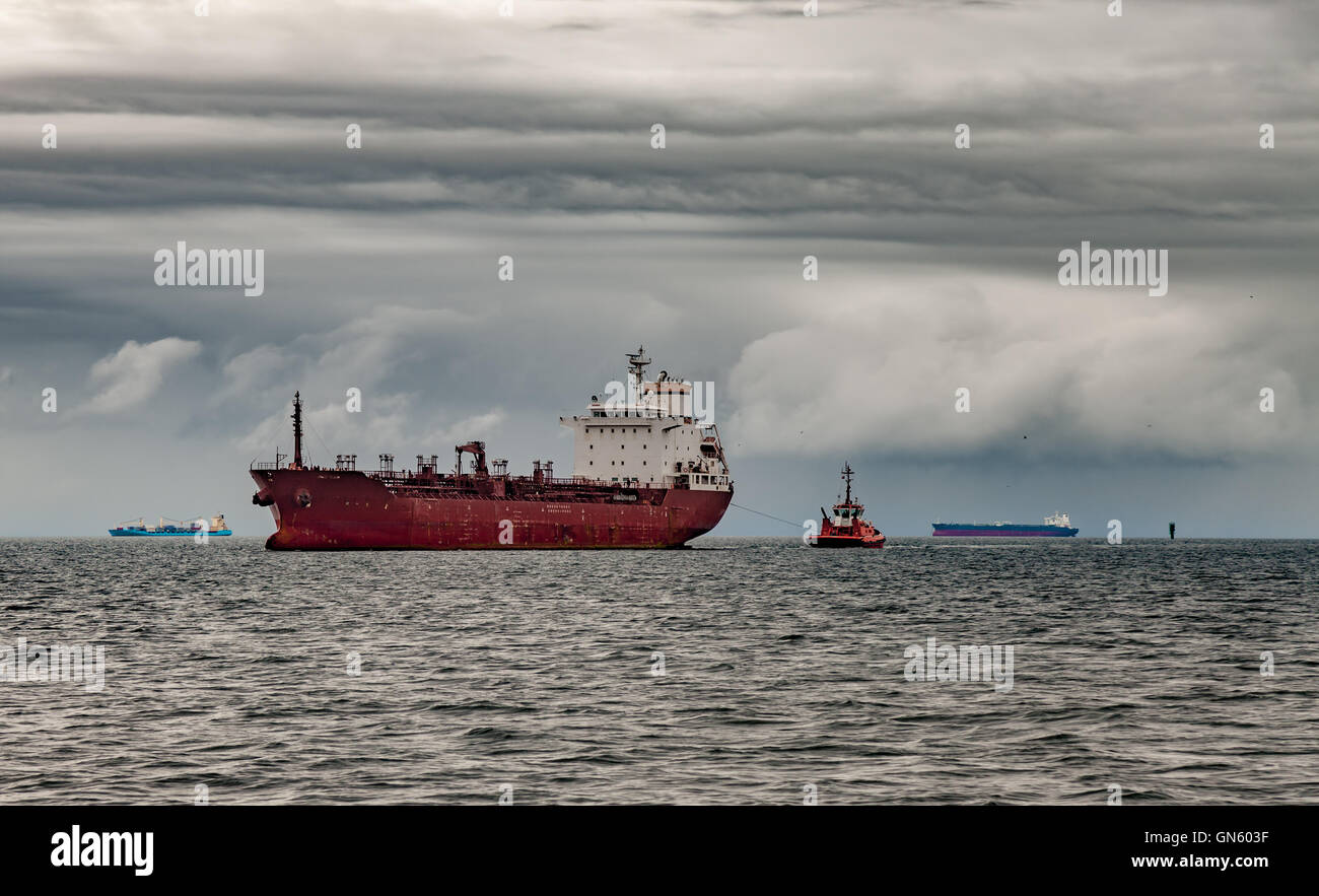 Ship at sea against a dramatic sky Stock Photo - Alamy