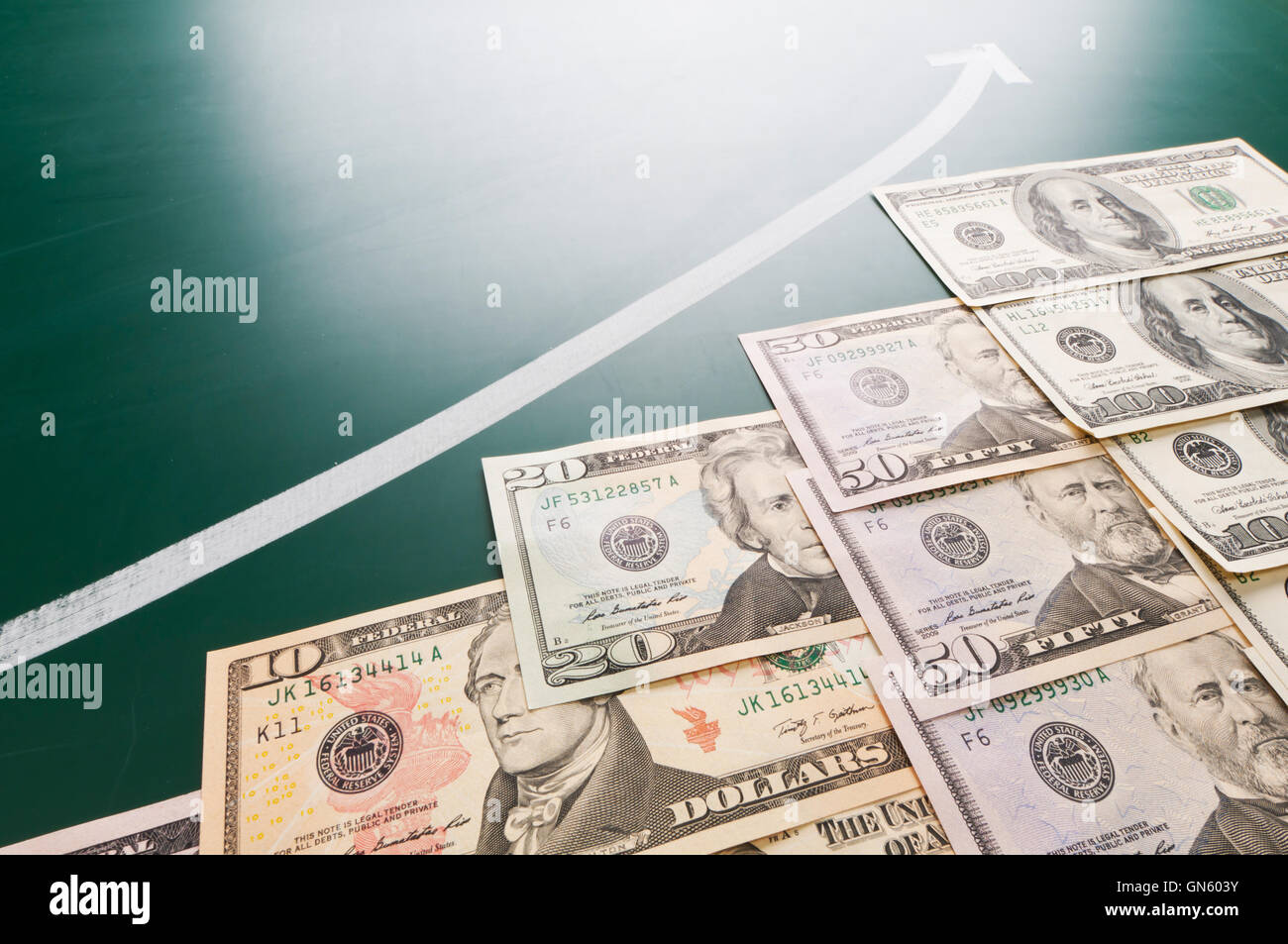 American banknotes and growing arrow Stock Photo - Alamy