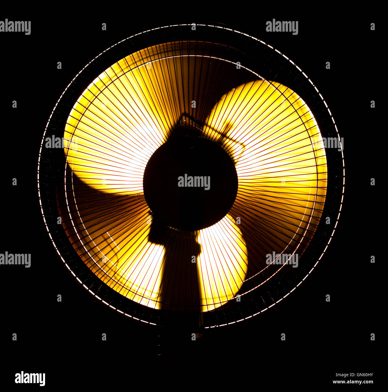 big office fan in yellow light Stock Photo - Alamy