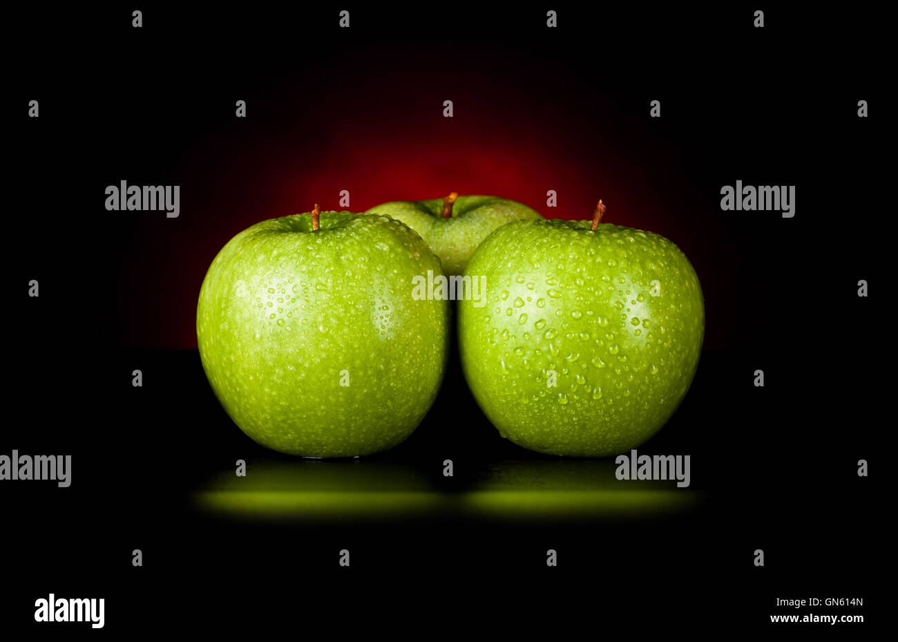 apples in red light Stock Photo - Alamy