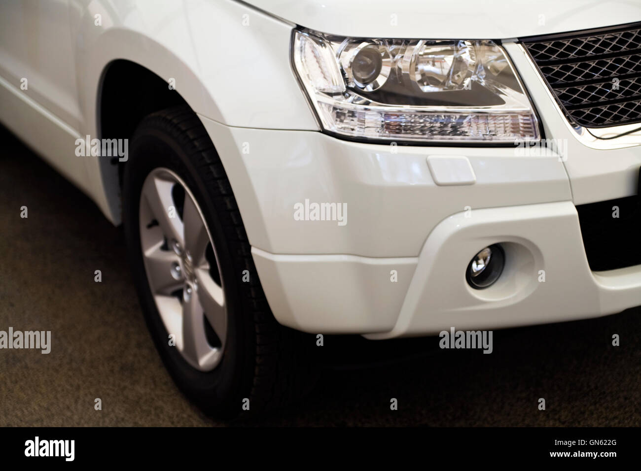 Headlights of the modern white car Stock Photo - Alamy