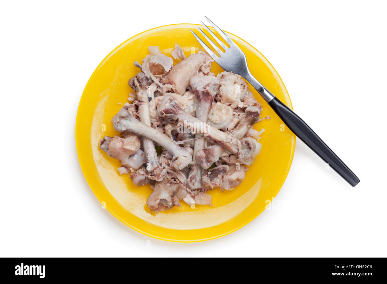 Chicken bones on plate Stock Photo - Alamy