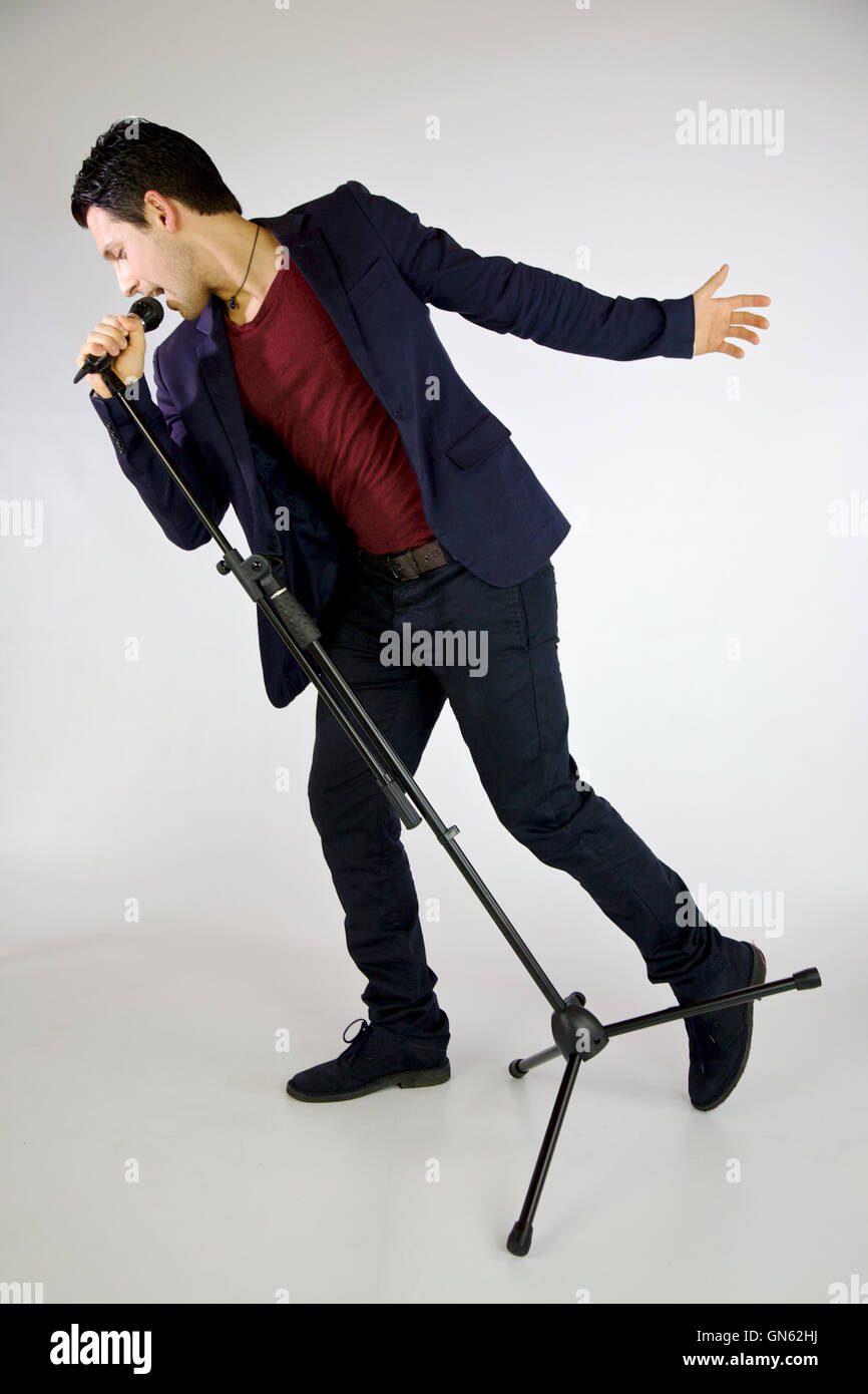 Man singing into microphone vertical Stock Photo - Alamy