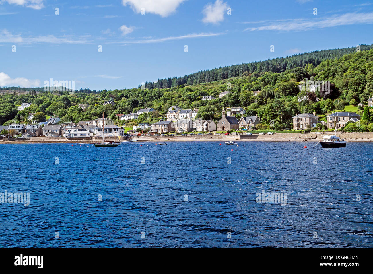 The coastal village of Tighnabruaich seen from the Kyles of Bute in ...
