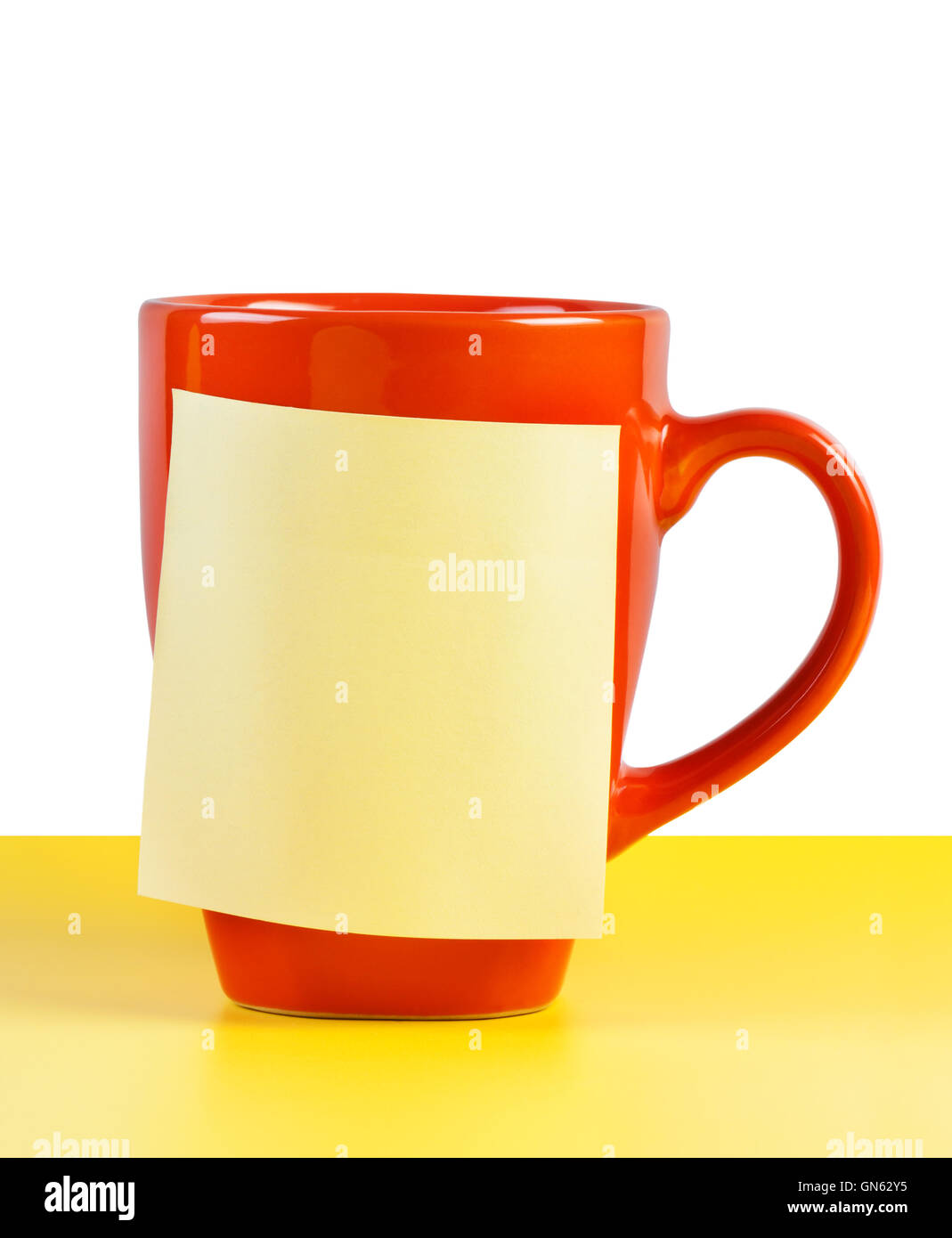 Cup with note paper Stock Photo - Alamy