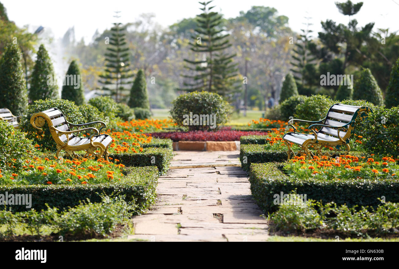 Two benches in the garden Stock Photo - Alamy