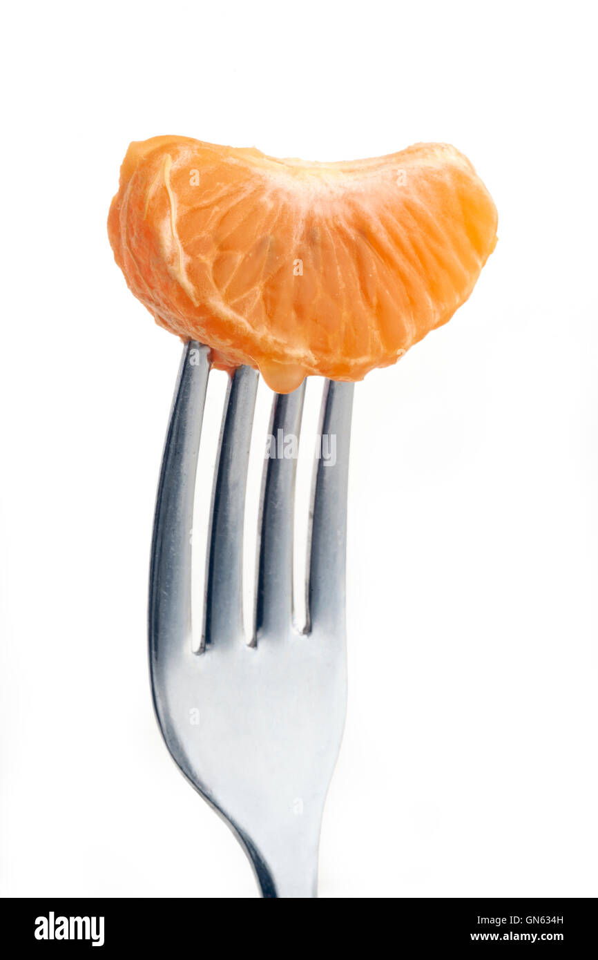 orange on fork Stock Photo - Alamy