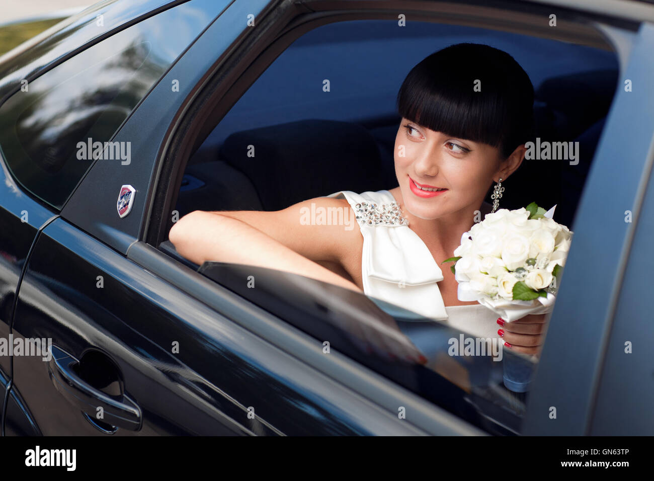 portrait of the bride in the wedding car Stock Photo - Alamy